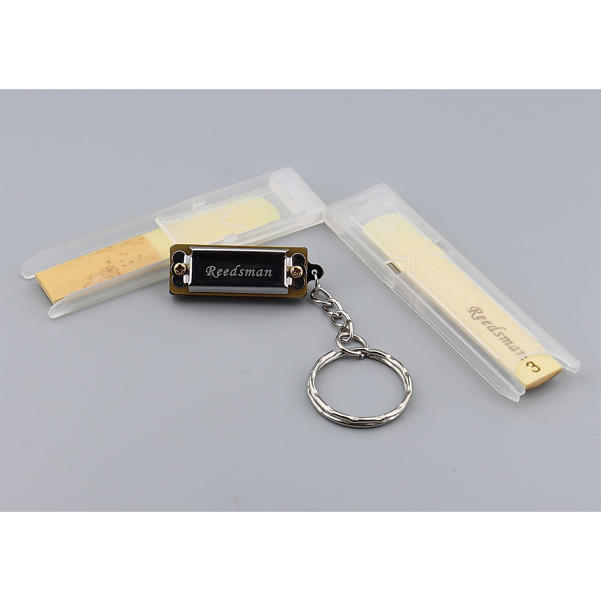 Reedsman Traditional Bb Clarinet Reeds, Includes 10 Plus 2 Total 12 Pack Reeds With Individual Reed Holders and One Mini Harmonica. (Strength 3.0)