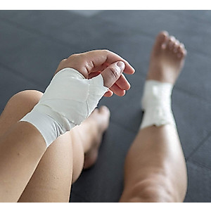 Titan Athletics - 12 Pack of Premium Quality White Athletic Tape/Sports Tape - 1.5 Inch x 45 Feet Per Roll - 100 Percent Cotton with Zinc Oxide - Easy Tear Zig Zag Design and No Sticky Residue