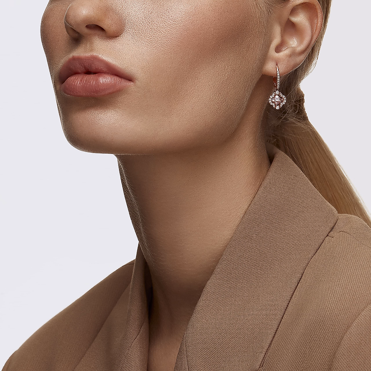 Swarovski Una Pierced Earrings with Clear Crystal Pavé Surrounding a Pink Stone on a Rose-Gold Tone Finished Setting