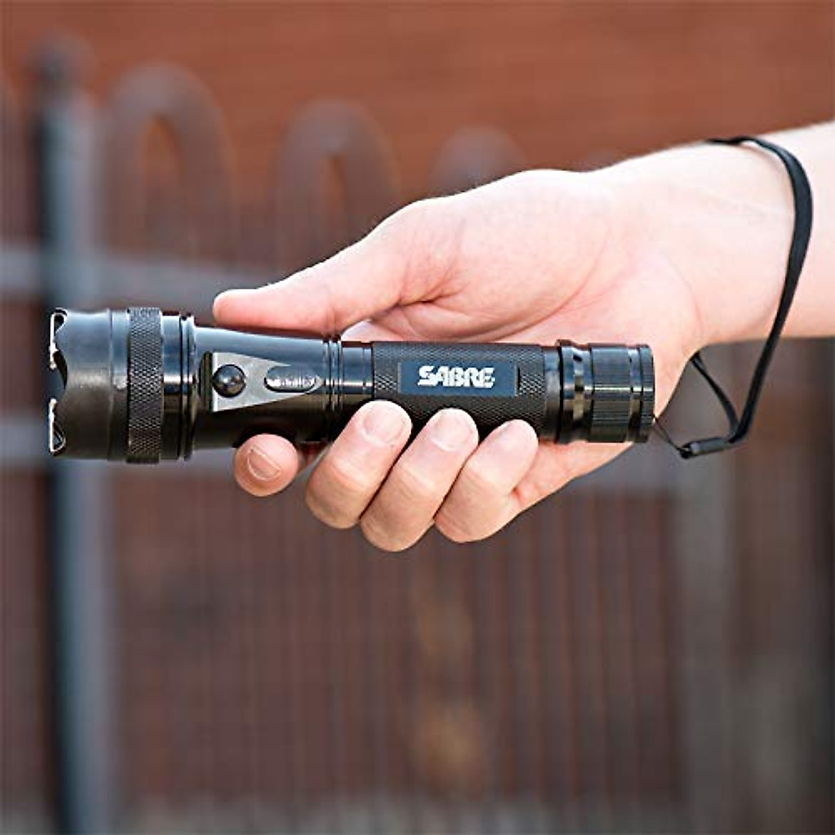 SABRE 2-in-1 Stun Gun with Flashlight and Belt Holster, Emits .76 Powerful Pain-Inducing Microcoulombs (µC) Charge, 130 Lumen Flashlight, Safety Switch, Rechargeable