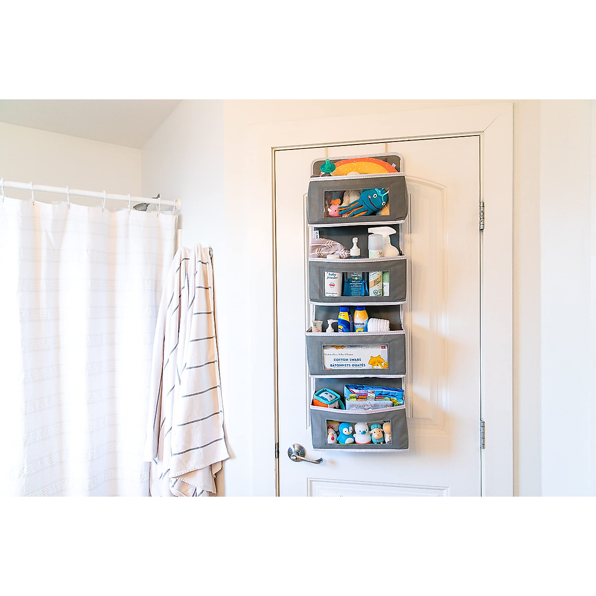 Cradle Essentials Over Door Hanging Organizer | Storage Caddy for Newborn and Baby Items, Stuffed Animals | Large Pockets with Clear Windows for Nursery, Mudroom, Bathroom, Laundry, Pantry, Closet