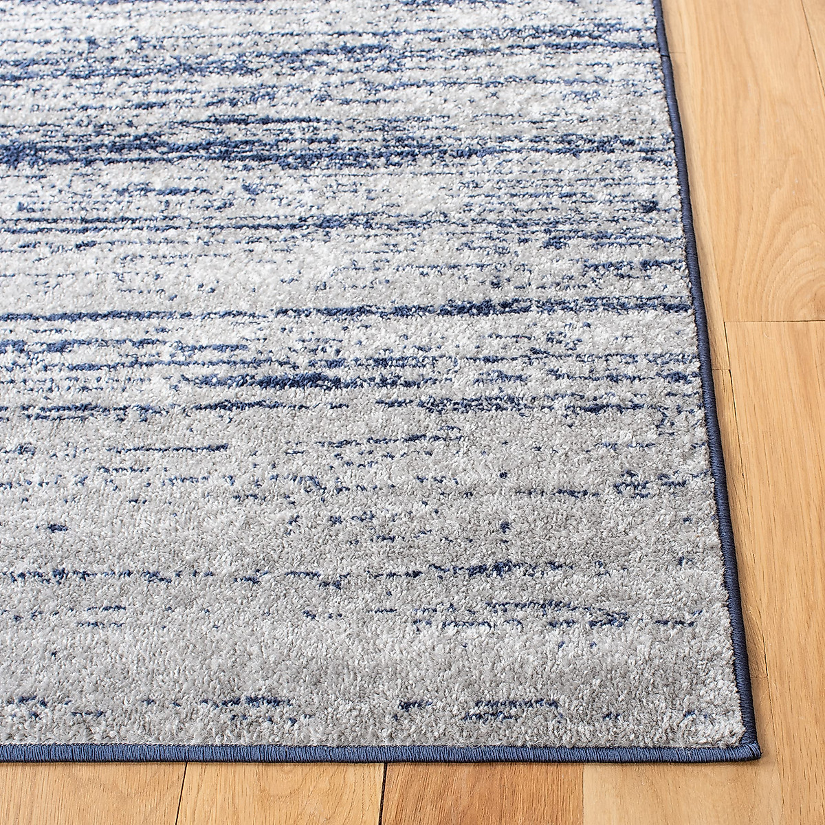 SAFAVIEH Adirondack Collection Area Rug - 9' x 12', Navy & Grey, Modern Ombre Design, Non-Shedding & Easy Care, Ideal for High Traffic Areas in Living Room, Bedroom (ADR113E)