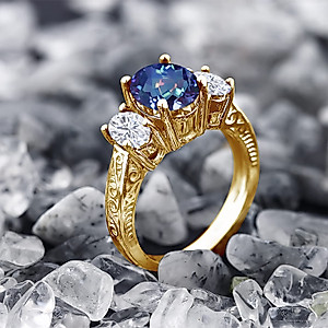 Gem Stone King 18K Yellow Gold Plated Silver 3-Stone Ring Oval Millennium Blue Mystic Quartz and Moissanite (2.80 Cttw) (Size 6)