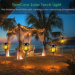 TomCare Solar Lights Outdoor Solar Torch Lights with Flickering Flame Waterproof Solar Powered Garden Lights Decorative Outdoor Lighting Landscape Decorations for Yard Patio Pathway Christmas, 4 Pack