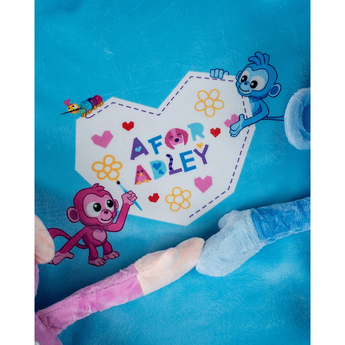 A FOR ADLEY Official Merch Monkey Buddies, A Pink and Blue Monkey Ready to Be Your Favorite Stuffed Animal Friend. Comes with Carrying Bag.
