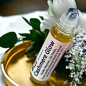 Urban ReLeaf Cashmere Glow Cologne Oil Roll-On. A Romantic Blend of Golden Peaches, Lily Petals, Cozy Vanilla, Sensual Musk & Wood. Long Lasting Fragrance Oil, Moisturizing Jojoba, Alcohol-Free Scent. Made in USA. Fits in pocket. TSA approved size.