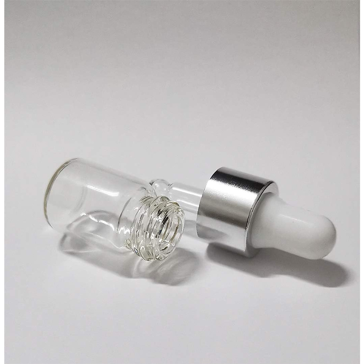 ZbFwmx 50 Pcs Mini Glass Dropper Bottle Lab Dropping Bottles Essential Oil Dropper Bottles Cosmetic Sample Vials Dropping Sample Containers Eye Dropper Dispenser (Silver-Clear, 1ML)