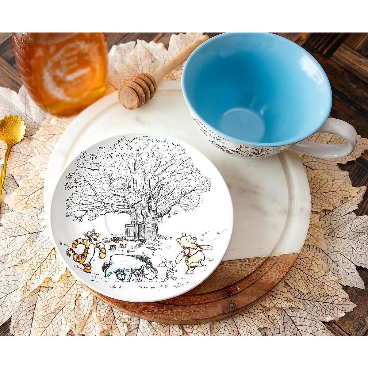 Silver Buffalo Disney Winnie the Pooh Walking Classic Scene Ceramic Teacup and Saucer, 12 Ounces