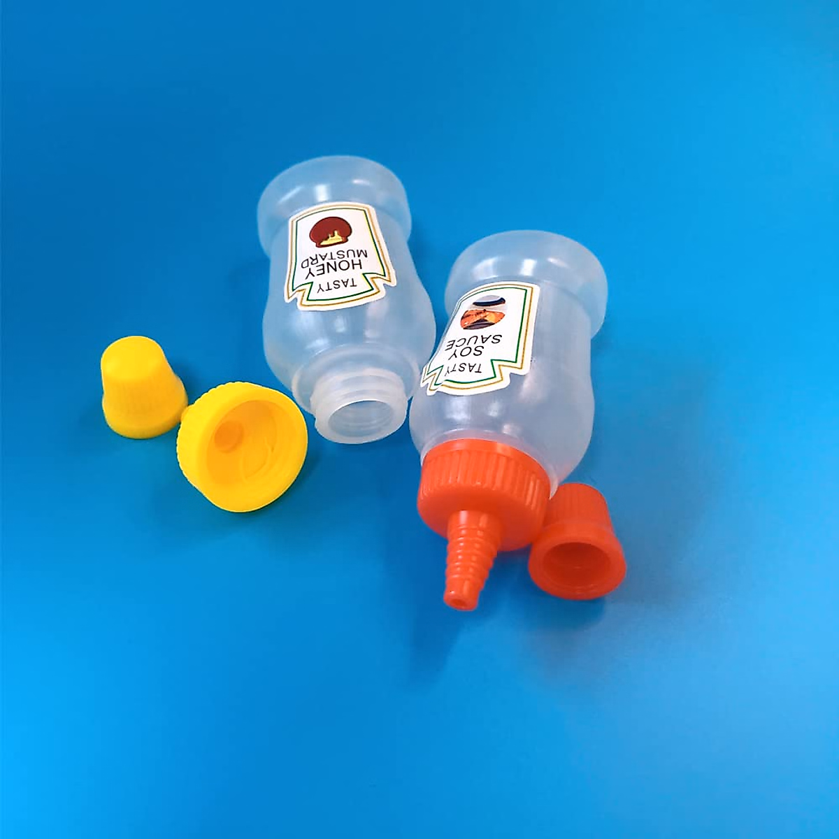 HYMAOME 4pcs Mini Condiment Squeeze Bottle Ketchup/Soy Sauce/Honey/Salad Dressing Container Portable Reusable Lunchbox Dispensers with Screw Cap,25ml