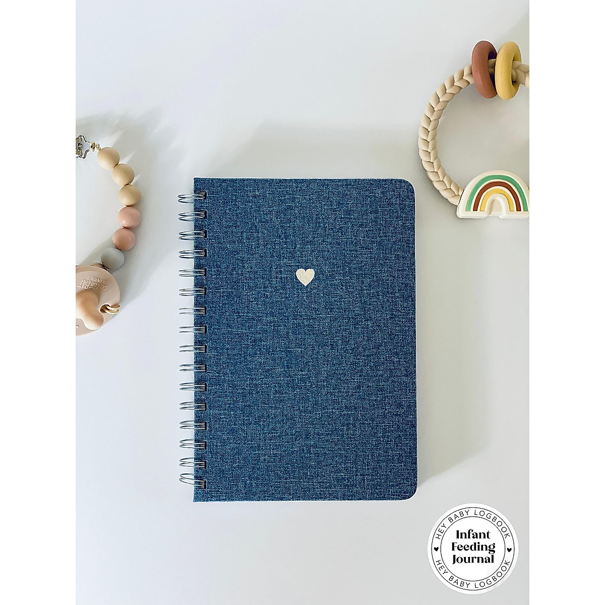 Baby's Daily Logbook, Breastfeeding Journal, Track your Infant’s Feedings, Sleep, and Diaper changes. Plus Bonus Sections including: Growth Charts, Illness Charts, Milestones, Teeth Chart, Doctor appointment notes, and Storage Pocket.