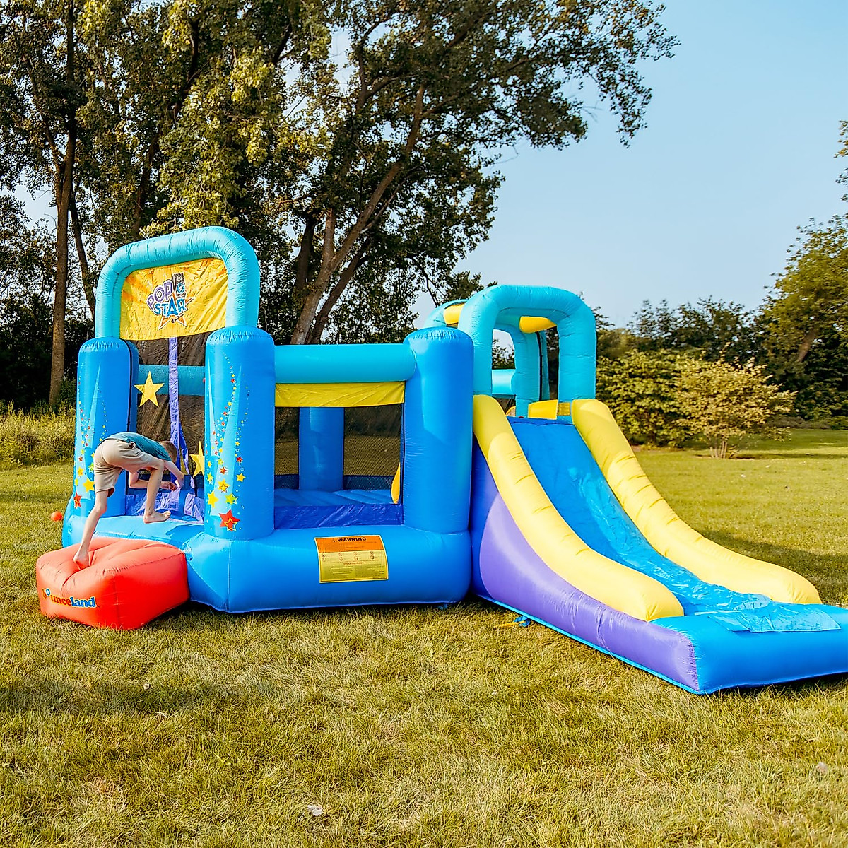 Bounceland Pop Star Inflatable Bounce House Bouncer, Large Bouncing Area with Long Slide, Climbing Wall, Basketball Hoop, UL 1HP Blower Included, 15 ft x 13 ft x 8.3 ft H, Pop Star Kids Party Theme