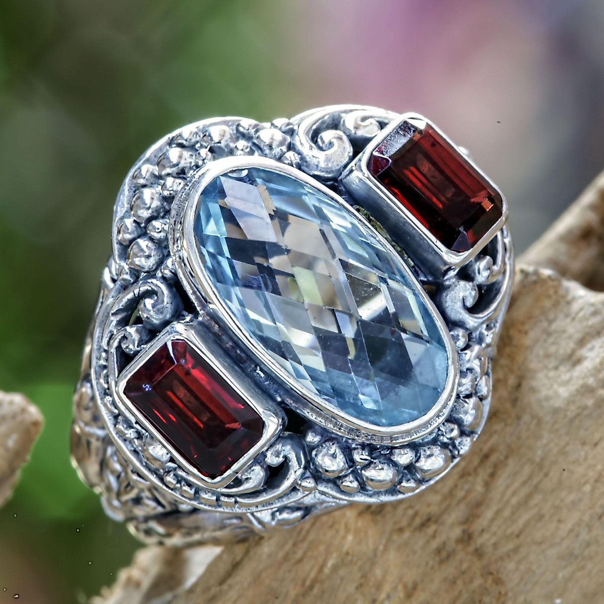 NOVICA Artisan Handmade Blue Topaz Garnet Cocktail Ring Silver from Bali Sterling Red Multi Stone Indonesia Birthstone [crownbezel 0.6 in L x 0.7 in W x 0.4 in H Band Width 4 mm W] ' Limpid Pool'