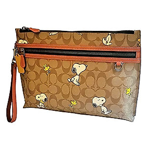 COACH Peanuts Carry All Pouch With Snoopy Woodstock Print