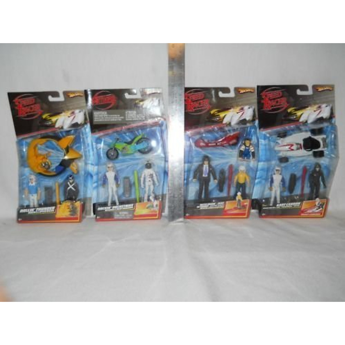 Hot Wheels Speed Racer Action Figure 2 Packs. The Four Included Speed Racer Two Packs are Rollin Thunder, Battle Board, Rockin Rocketbike, Kart Cannon. Includes Speed Racer (3), Pops, Spridle, Chim