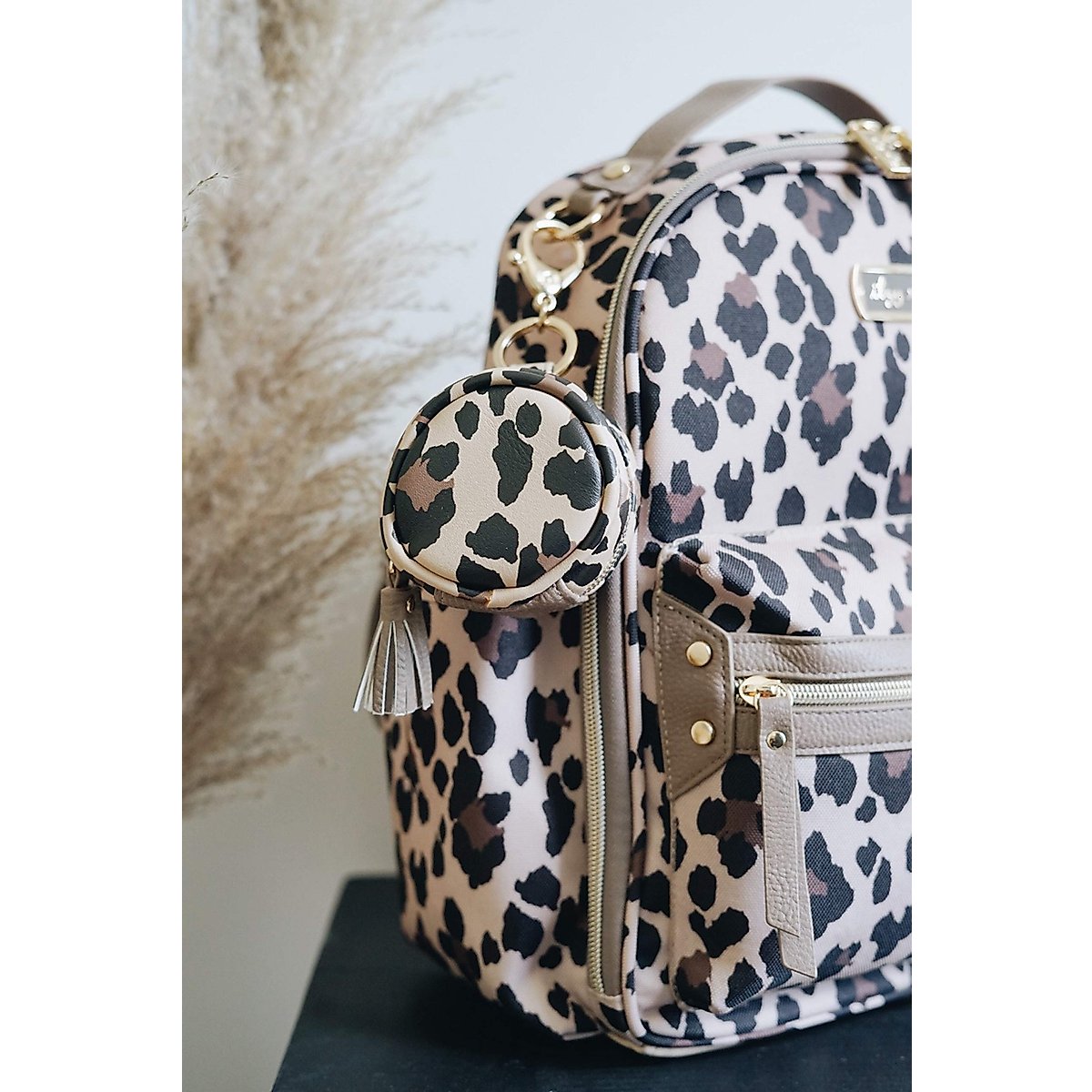 Itzy Ritzy Pacifier Holder Case with Clip - Pacifier Case Includes Clasp to Easily Attach to a Diaper Bag or Purse, Measures 2.5" in Diameter and Holds 2 Pacifiers (Leopard)