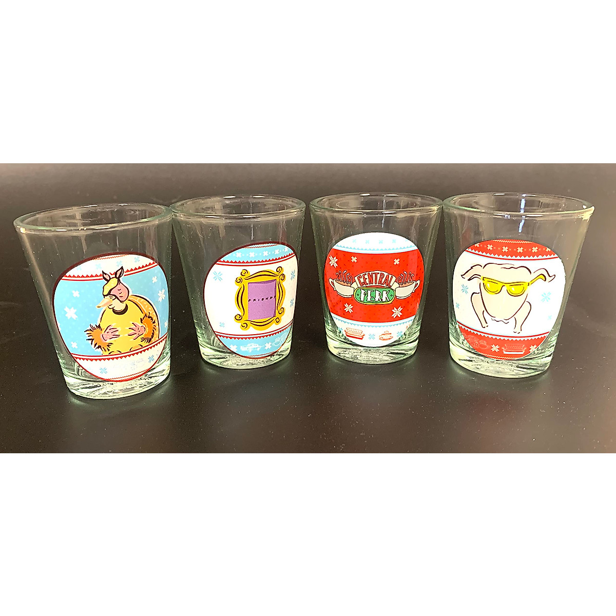 Friends The Television Series Set Of Four Shot Glasses! Featuring The Holiday Armadillo, The Thanksgiving Turkey, Central Perk Logo And Infamous Picture Frame! Fiends TV Show Inspired Glassware Set!