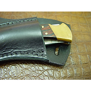 Custom Left Hand Cross Draw Knife Sheath for a Buck 110 Knife. The Sheath is Made Out of Buffalo Hide Leather Dyed Black.