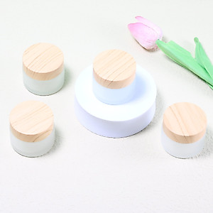 4 Pack 1oz Frosted Glass Cosmetic Cream Jar Bottle Refillable Glass Face Cream Pot Cosmetics Container With Plastic Wood grain lids and Inner Liners For Face Cream Eye Cream Lip Balm Ointments Salves