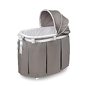 Wishes Oval Rocking Baby Bassinet with Bedding, Storage, and Pad