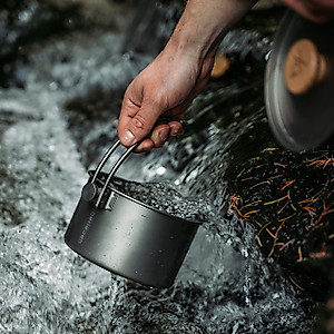 Überleben Kessel - Camping Kettle Pot with 37Fl Oz (1.1L) Capacity, Hanger Handle, Natural Hardwood Grip, Locking Lid, & Steam Vents - Available in Stainless Steel or Titanium - Includes Canvas Bag