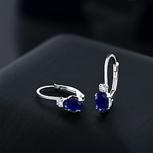 Gem Stone King 14K White Gold Blue Sapphire and White Created Sapphire Leverback Earrings For Women | 1.18 Cttw | Gemstone September Birthstone | Oval 6X4MM, Round 2MM | 3/4 Inch