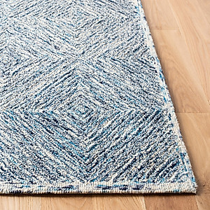 SAFAVIEH Capri Collection Area Rug - 9' x 12', Ivory & Blue, Handmade Wool, Ideal for High Traffic Areas in Living Room, Bedroom (CPR207A)