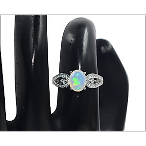 925 Sterling Silver Natural Ethiopian Welo Cut Opal 9X7 MM Oval October Birthstone Solitaire Unisex Proposal Ring For Engagement Gift (Rhodium Plated Silver, 7.5)