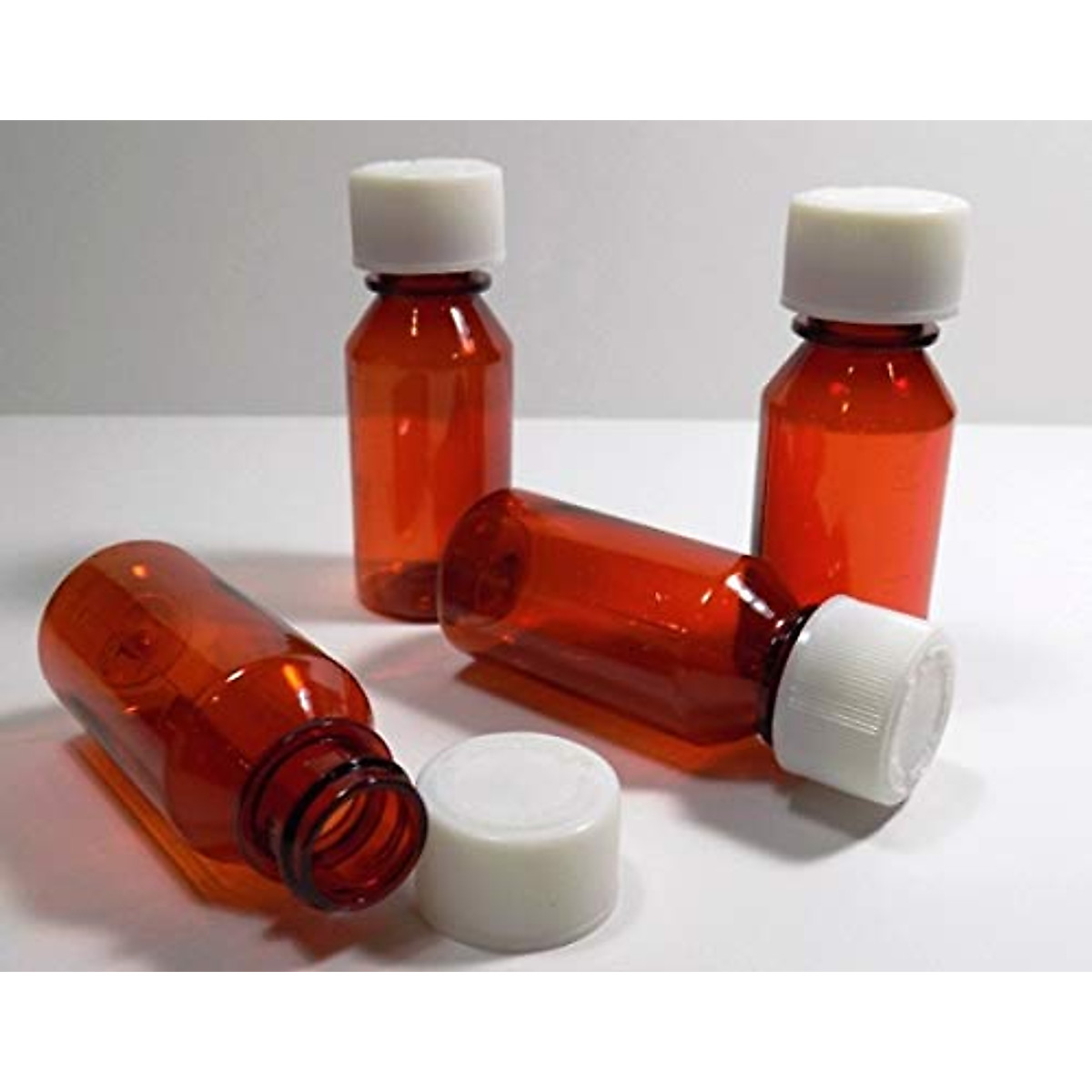 Case of 200 Graduated Oval Hard Side Round 1 Ounce Plastic Amber RX Medicine Bottles w/Caps-Pharmaceutical Grade-The Ones We Sell To Pharmacies, Hospitals, Physicians, Labs