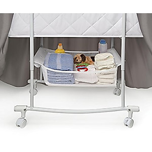 Wishes Oval Rocking Baby Bassinet with Bedding, Storage, and Pad