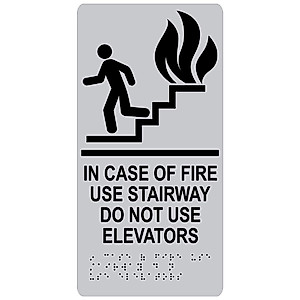 ComplianceSigns.com in Case of Fire Use Stairway Sign, ADA-Compliant Braille and Raised Letters, 12x6 in. Black on Silver Acrylic with Mounting Strips