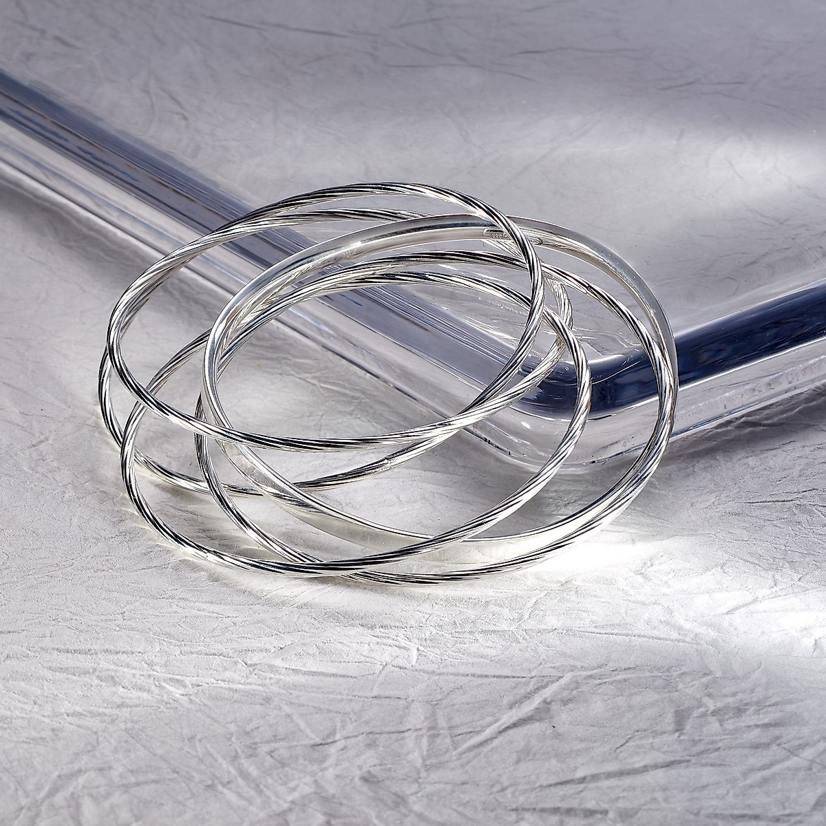 Ross-Simons Sterling Silver Textured and Polished Rolling Bangle Bracelet. 7 inches