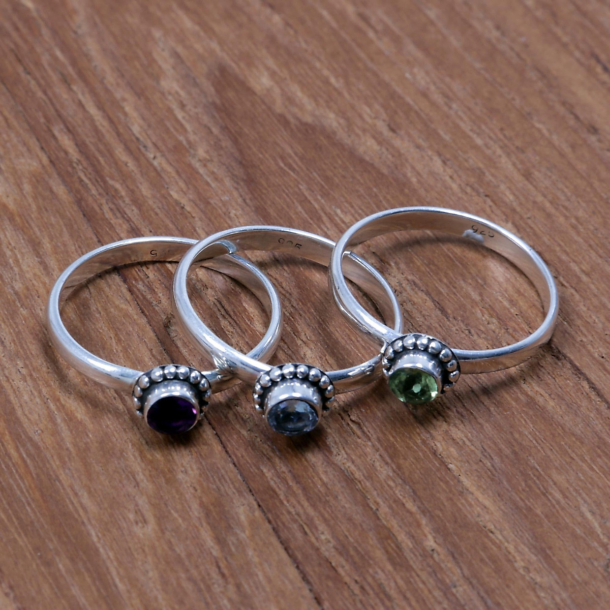 NOVICA Artisan Handmade Multigemstone Stacking Rings Sterling Silver Set of 3 Amethyst Blue Topaz Peridot Green Purple Multicolor Indonesia Modern Birthstone [crownbezel 0.2 in H x 0.2 in Diam. Band ]