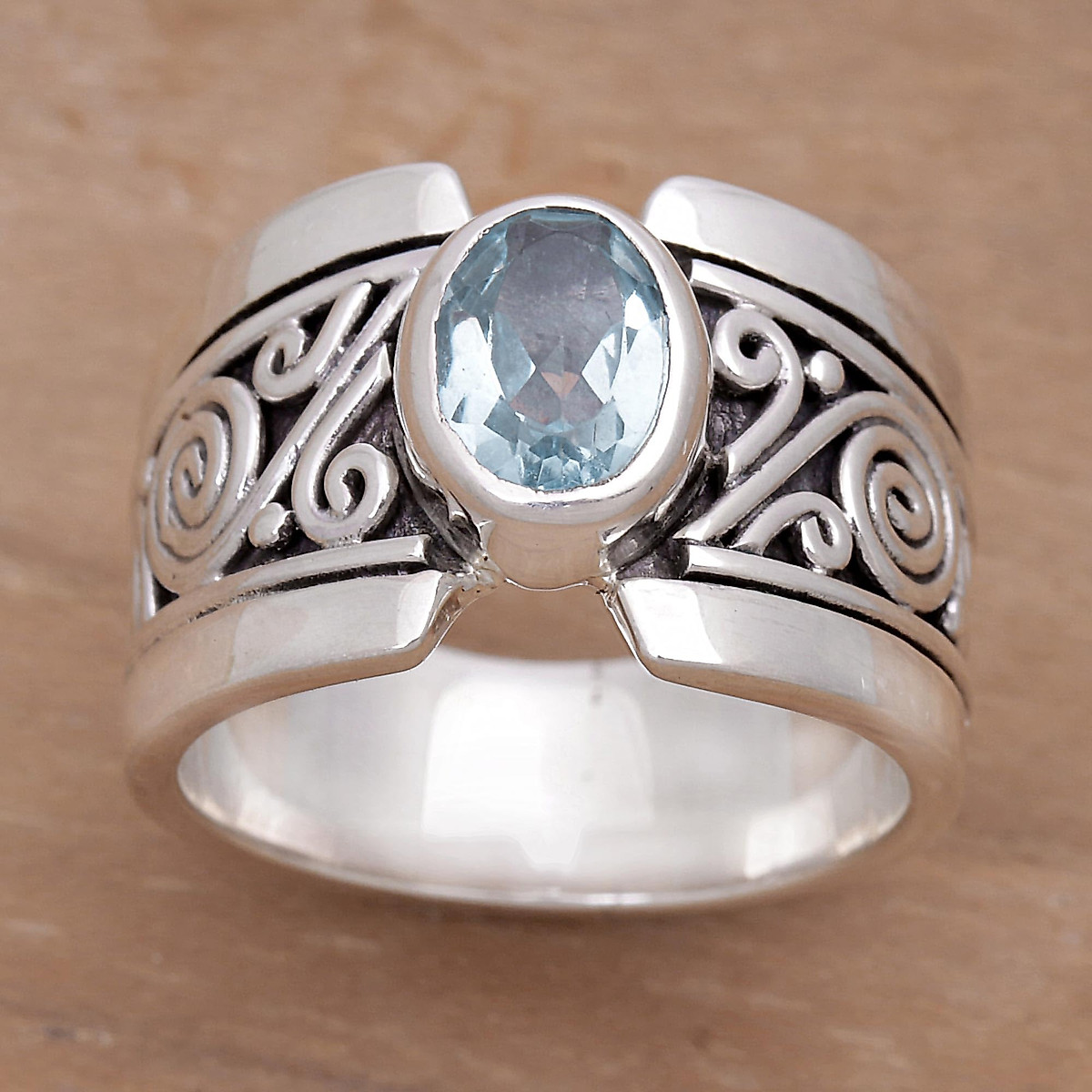 NOVICA Artisan Handmade Blue Topaz Single Stone Ring Artisan Crafted Sterling Silver Wide with Indonesia Serenity Birthstone [crownbezel 0.4 in L x 0.3 in W x 0.2 in H Band Width 7 mm W] ' Blue