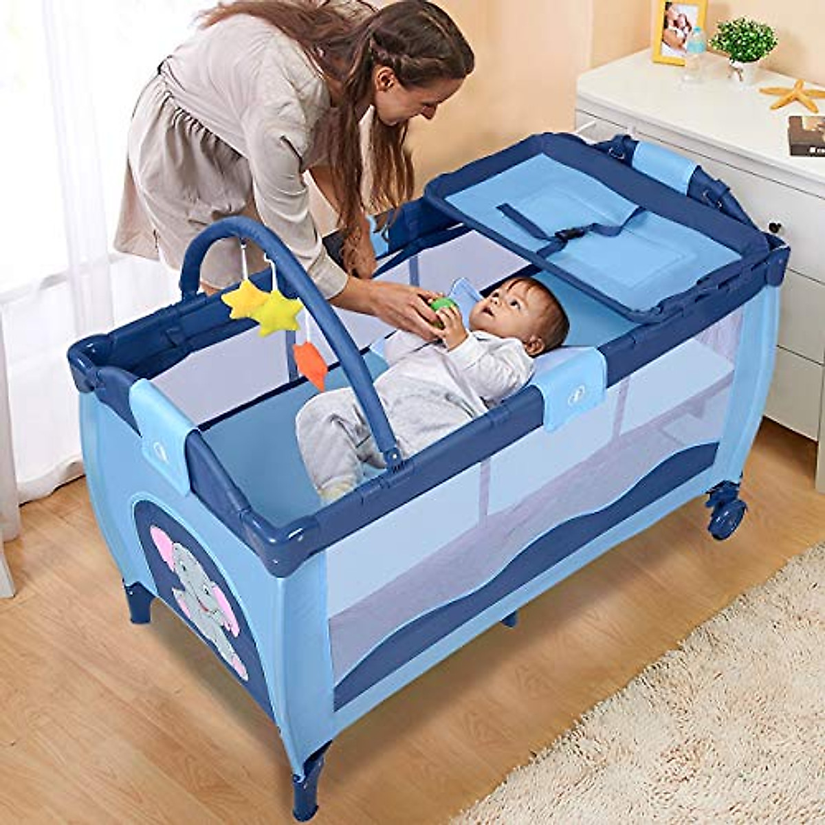 BABY JOY 3 in 1 Pack and Play, Portable Playard with Hanging Toys, 2 Lockable Wheels Diaper Changing Table, Foldable Travel Bassinet Bed (Blue)