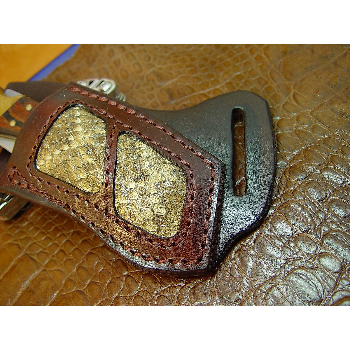Buck 110 Rattlesnake Right-hand Cross Draw Knife Sheath. The Sheath Is Made Out of 10 Ounce Water Buffalo Leather and a Rattlesnake Insert. It is Made to Wear on Your Left-Side and Drawn with Your Right Hand the Sheath Is Dyed Dark Brown. Sheath Only the