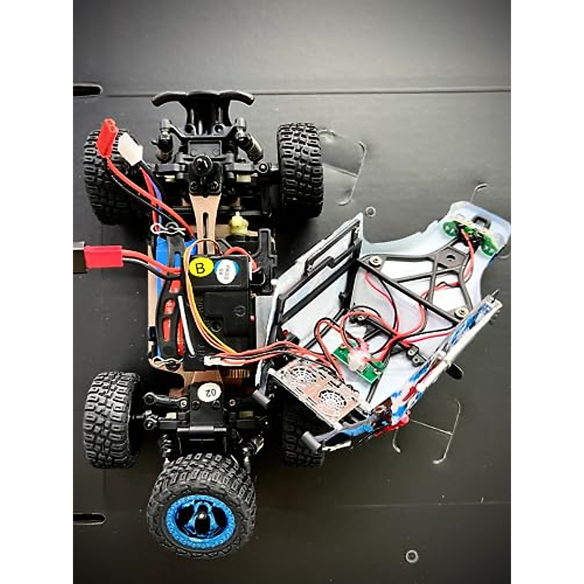 WLtoys 2.4G 4WD 1/28 30KM/H Brushed RC Monster Truck Off-Road Full Proportional Remote Control Car with LED Lights, RC Transmitter And Car Battery - RTR RC Toy Vehicle (RC Cars, RC Truck) (HELIDIRECT)