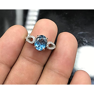 925 Sterling Silver Natural 9X7 MM Oval Cut Swiss Blue Topaz December Birthstone Solitaire Unisex Proposal Engagement Ring Wedding Jewelry Gift For Her (Rhodium Plated Silver, 7.5)