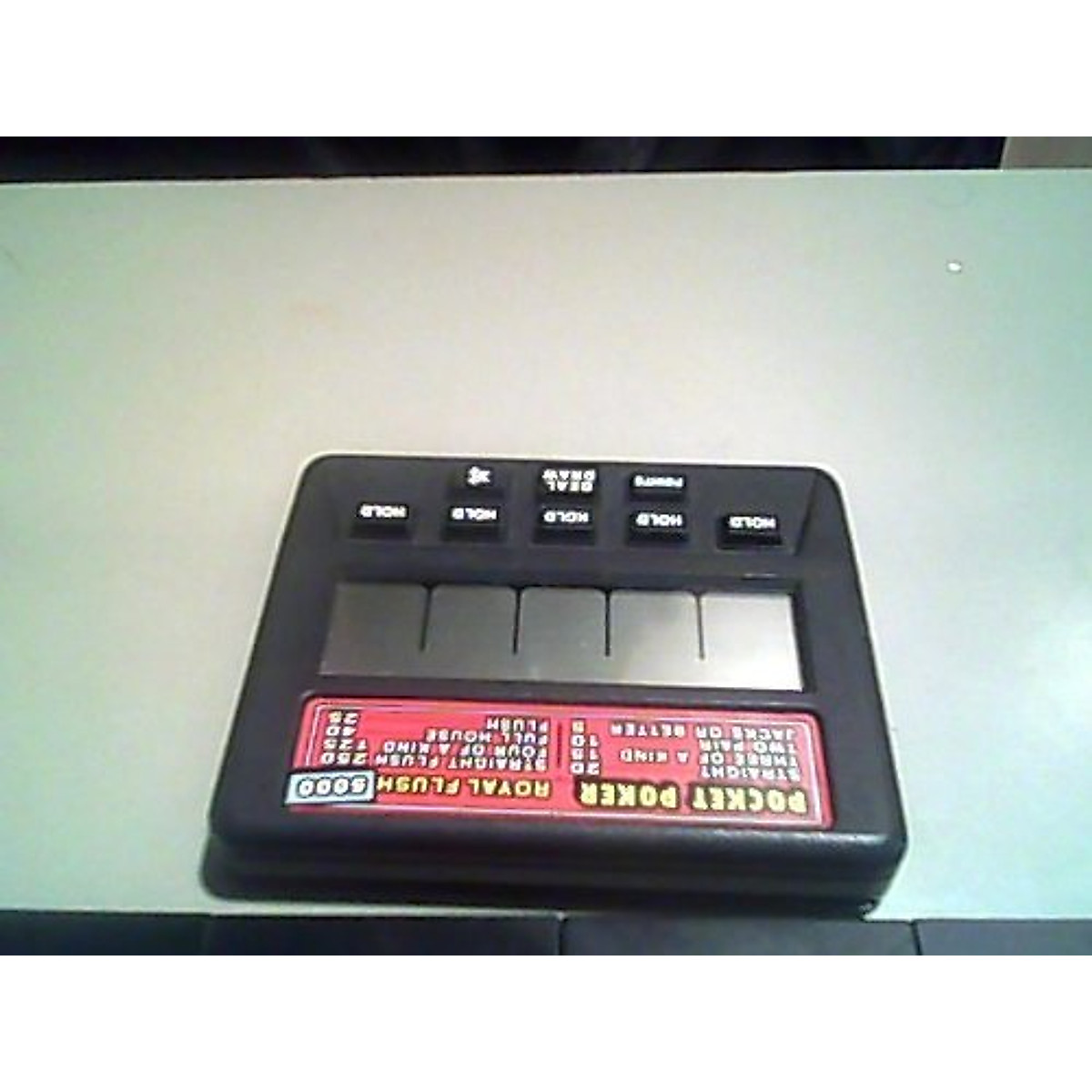 Radica: Ltd, H.k. Model:1310 Radica Pocket Poker Royal Flush 5000 Lcd Interactive Electronic Handheld Radica Model#1310 Royal Flush 5000 Version with Hold Button, Hold Button, Hold Button, Hold Button, Hold Button, Points Button, Deal Draw/on Button, Soun
