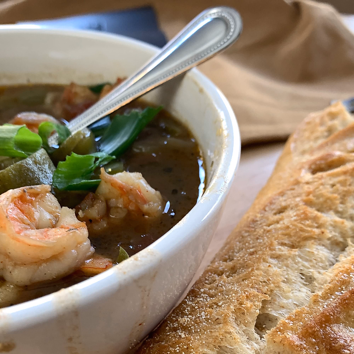 Bayou Classic CI7007 7-gal Cast Iron Jambalaya Kettle w/ Lid and Stand Features Cast Iron Lid w/ Stainless Built-In Lid Holder Steel Tripod Stand w/ Wide Leg Design Perfect For Large Event Cooking