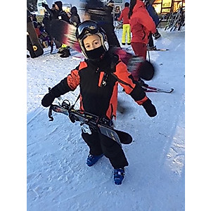 Carrier strap for single or multiple pairs of skis, poles, boots or snowboards