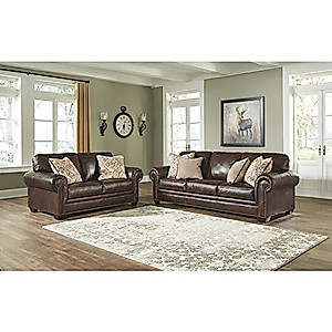 Signature Design by Ashley Roleson Traditional Leather Queen Sofa Sleeper with Nailhead Trim and 4 Accent Pillows, Brown