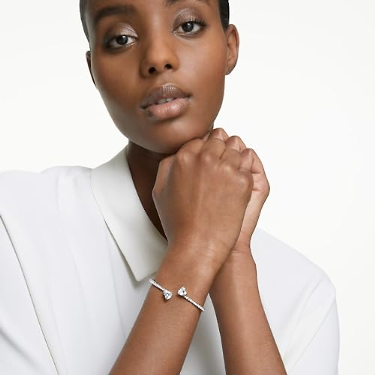 SWAROVSKI Mesmera Bangle Bracelet, Heart-Shaped Clear Crystals on a Rhodium Finish Cuff, Size M, from the Attract Soul Collection