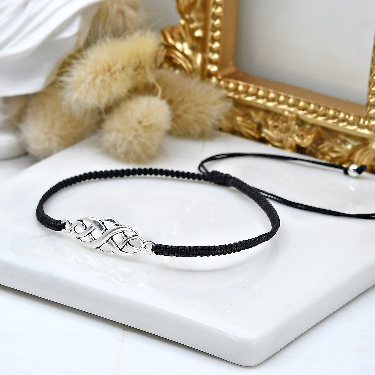 AeraVida Celtic Infinity Knot Rope Sterling Silver Charm on Black Adjustable Bracelet