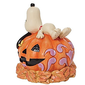 Enesco Peanuts by Jim Shore Halloween Snoopy Laying on Carved Pumpkin Figurine, 5.5 Inch, Multicolor