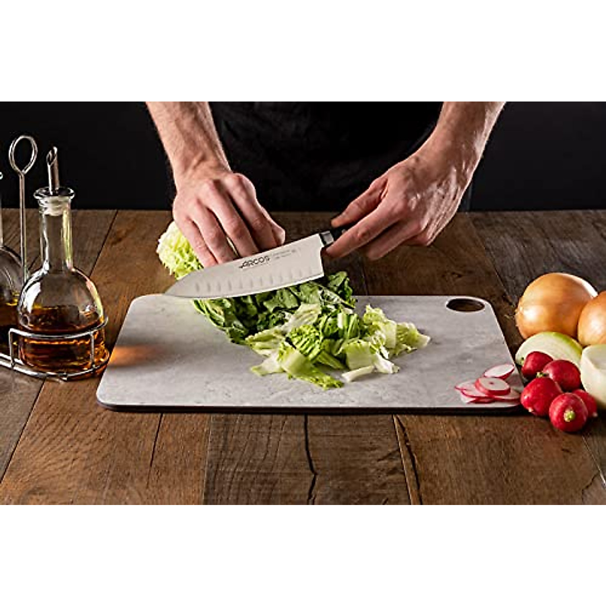 ARCOS Santoku Knife 7 Inch Nitrum Stainless Steel and 190 mm blade. Ergonomic Polyoxymethylene POM Handle.Classical design and rounded finish of great beauty and sturdiness. Series Opera. Color Black.