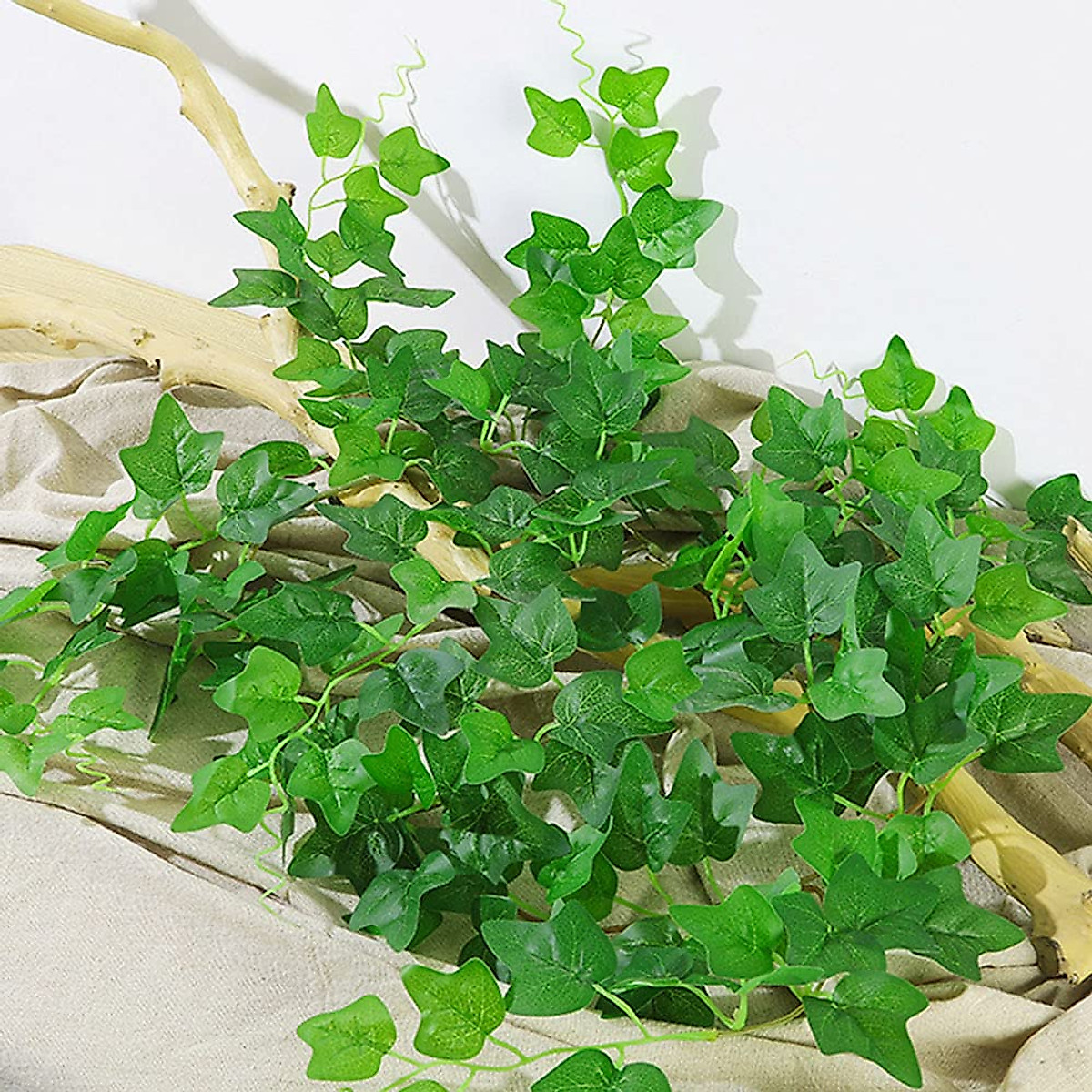 Qlarnaweer Artificial Fake Vines, 84Ft 12 Strands Artificial Ivy Leaf Greenery Garland Wall Decor Hanging Plants Foliage for Home Kitchen Garden Office Wedding Party