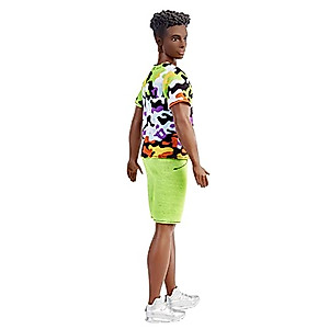 Barbie Fashionistas Ken Doll #123, Broad with Black Curly Hair Wearing Multi-Colored Camo Print Shirt, Neon Green Shorts & Silvery Sneakers