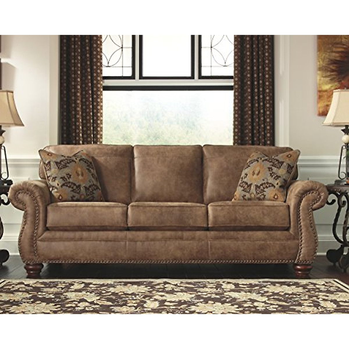 Signature Design by Ashley Larkinhurst Faux Leather Sofa with Nailhead Trim and 2 Accent Pillows, Brown