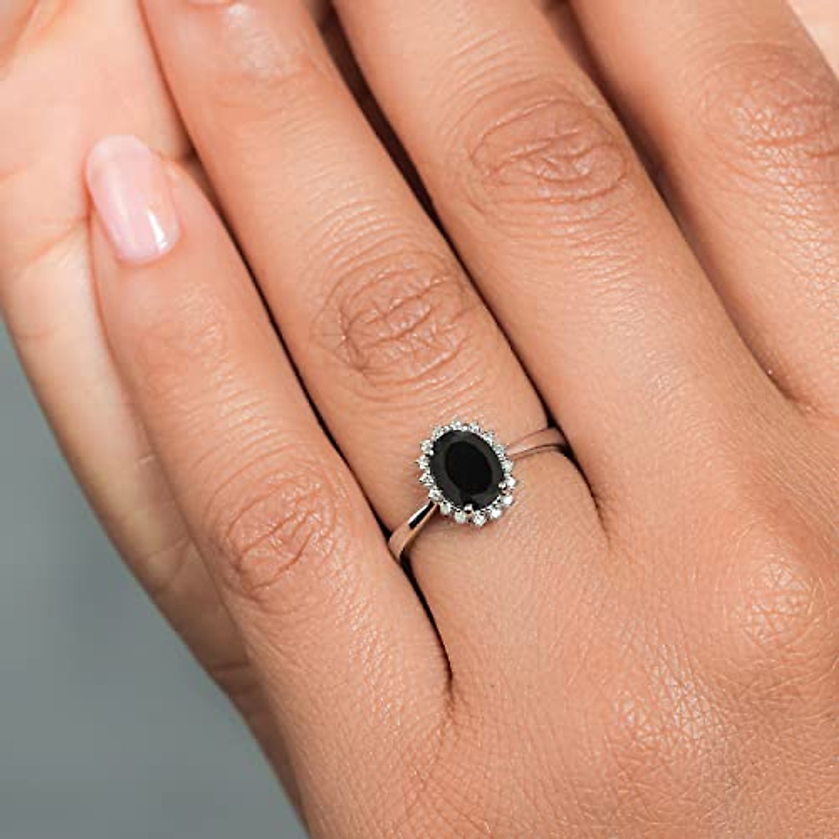 Gem Stone King 10K White Gold Black Onyx and Diamond Halo Engagement Ring For Women (1.65 Cttw, Oval 8X6MM, Size 9)