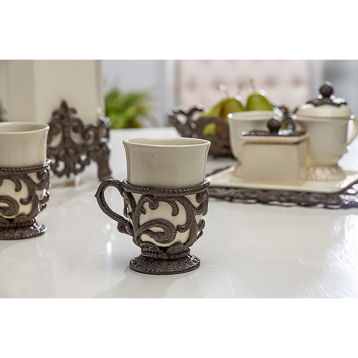 GG Collection Acanthus Leaf Cream Ceramic Cups with Brown Metal Base and Handle (Set of 4)